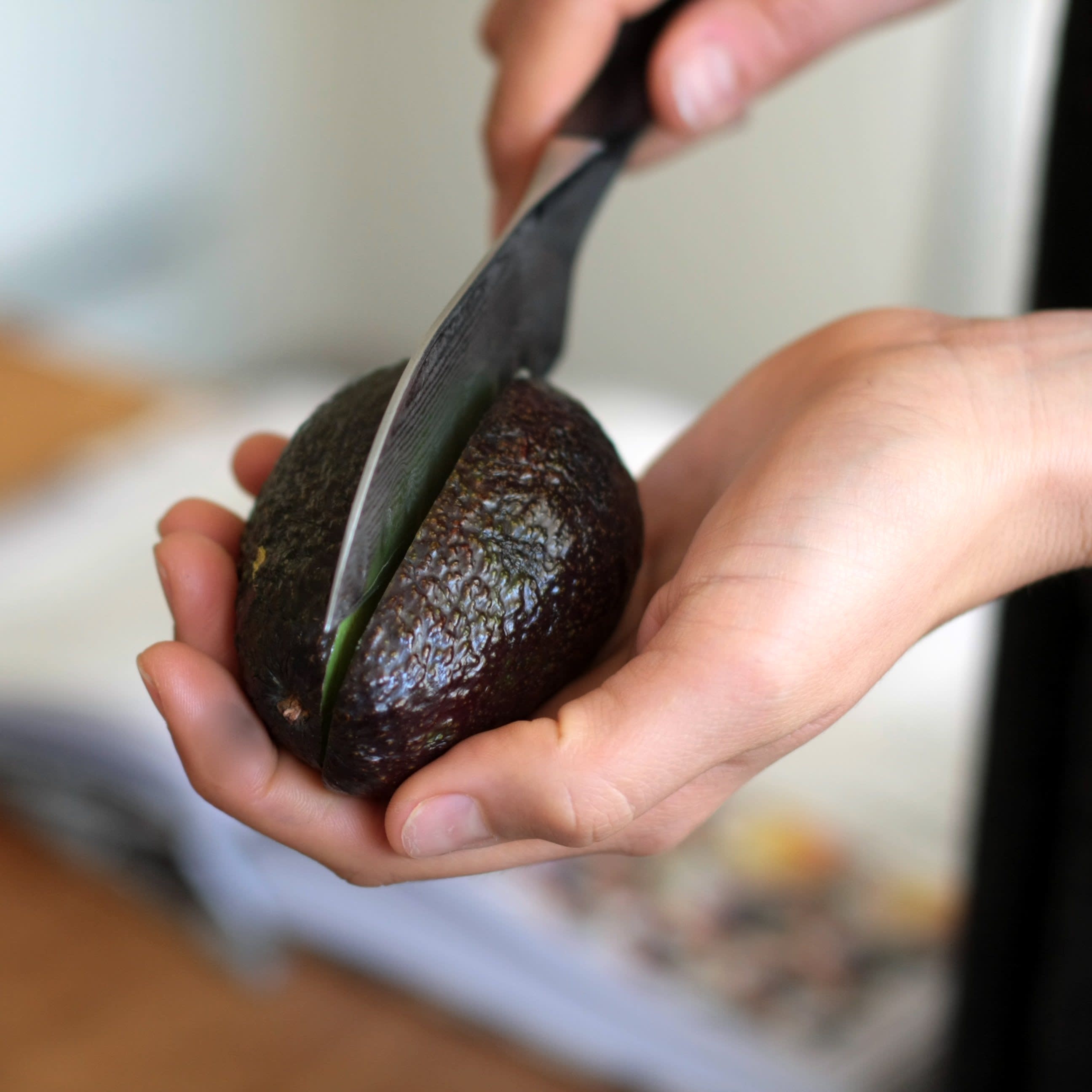 How To Remove an Avocado Pit with a Chef’s Knife | Kitchn