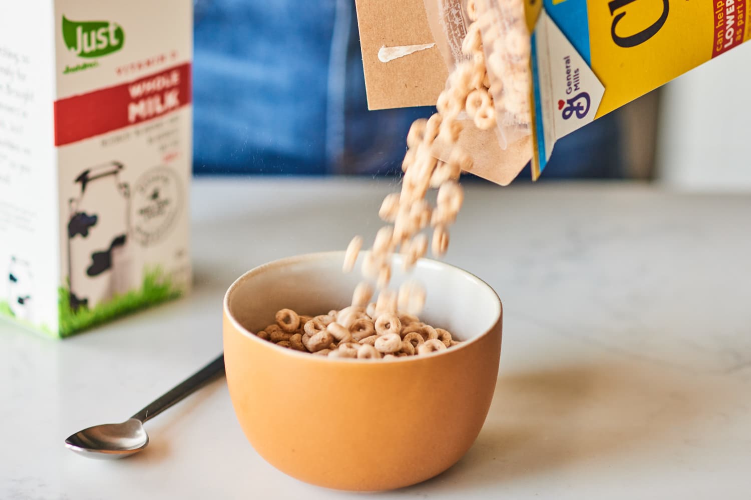pour milk in cereal box