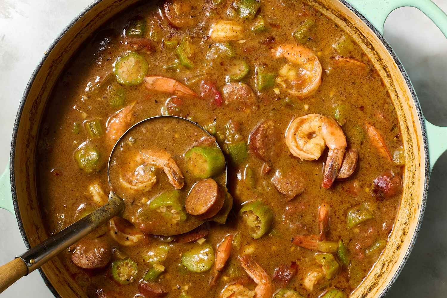 adding shrimp to gumbo