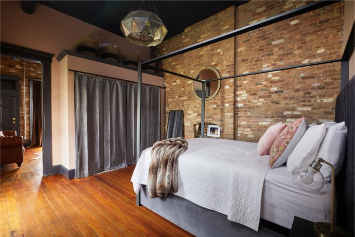 A Dated Blue Bedroom Gets a Dramatic Exposed Brick Makeover | Apartment ...