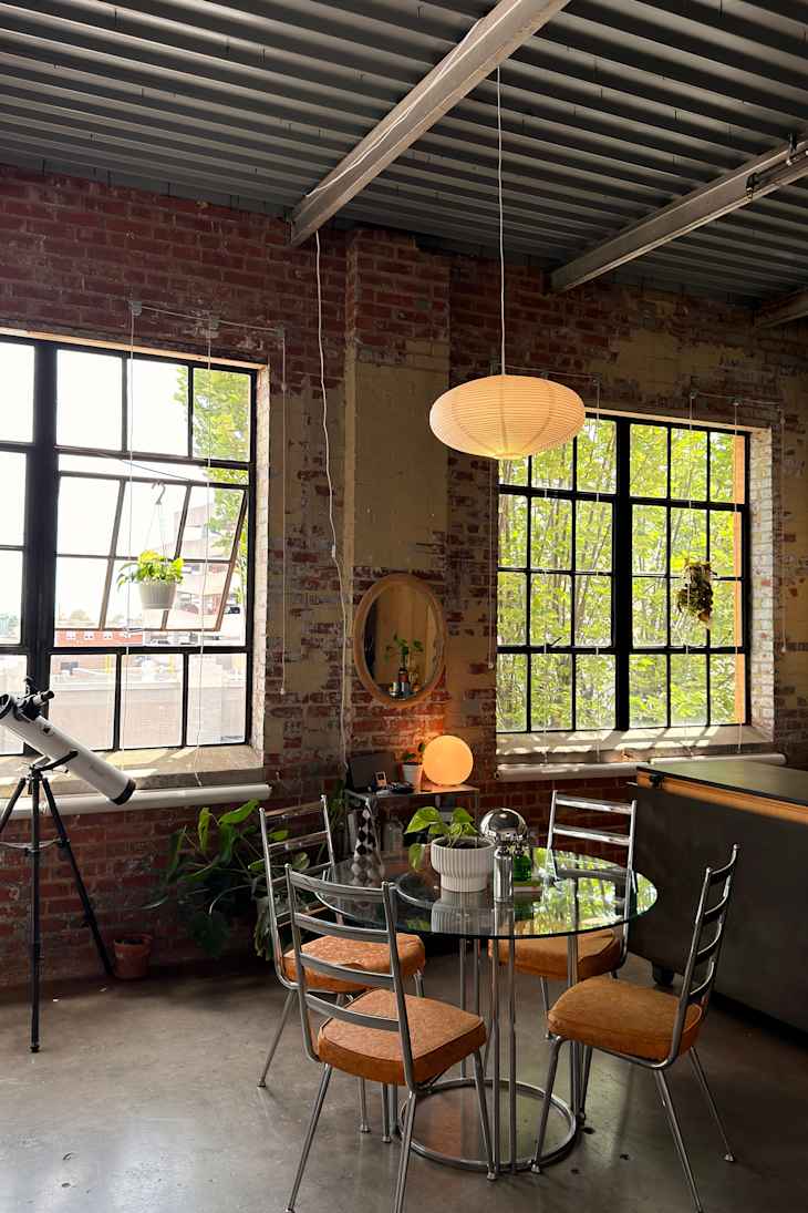 An Industrial Loft Feels More Like a Cozy 1990s Sitcom Than a Studio ...
