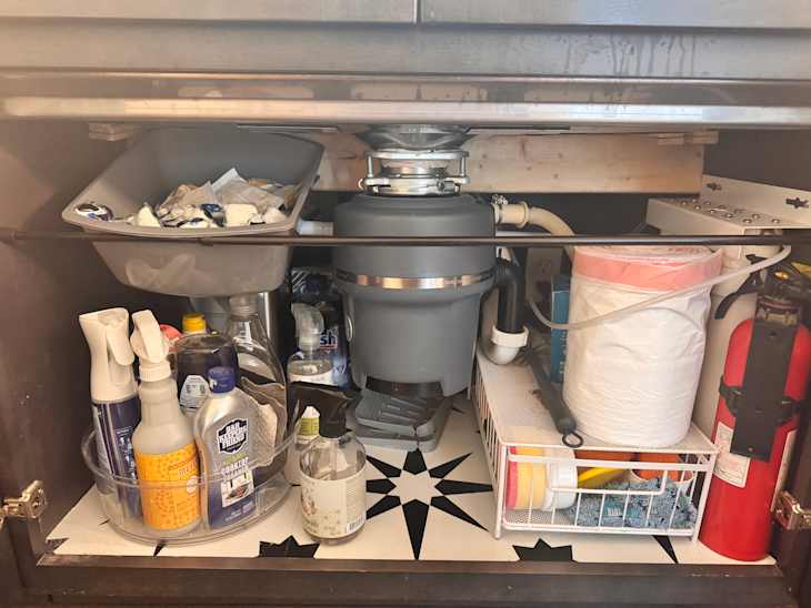 How to Use a Tension Rod to Organize Under Your Kitchen Sink | The Kitchn