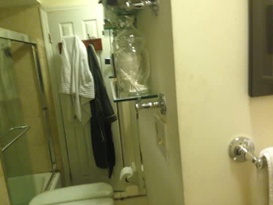 Before & After: A Boring Bathroom Gets Some Dark Drama | Apartment Therapy