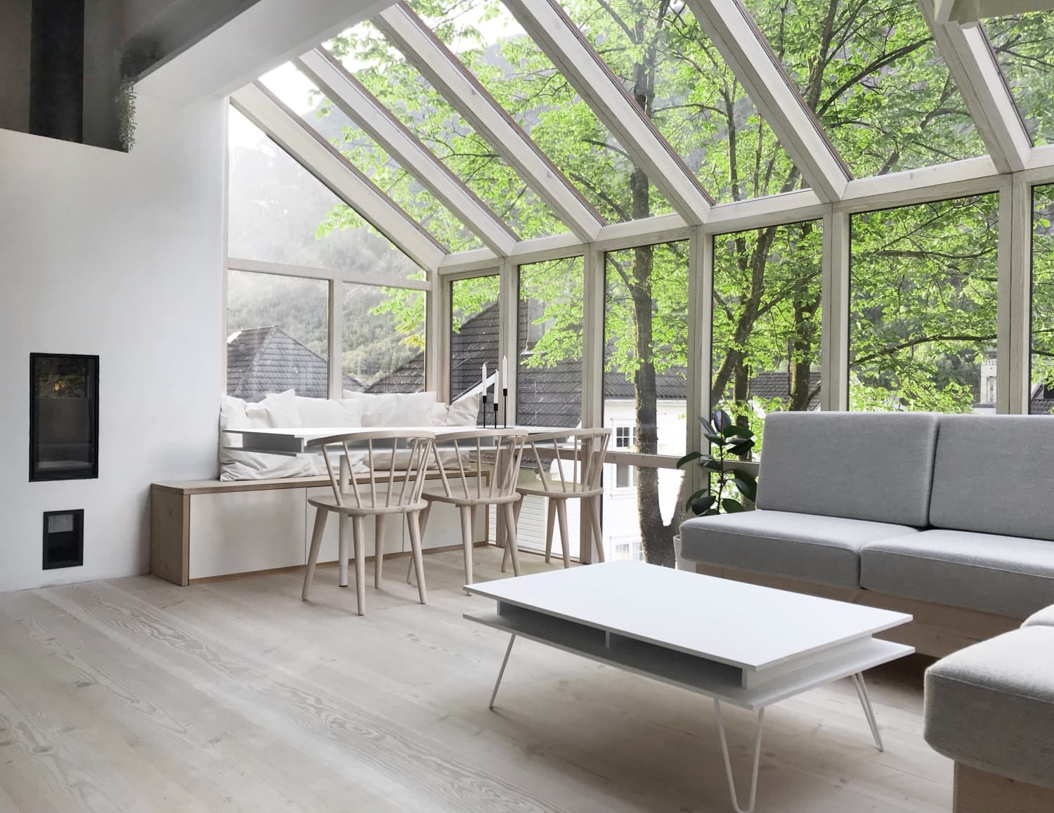 A Small, Minimal Scandinavian Home's Giant Windows Make It Feel Much ...